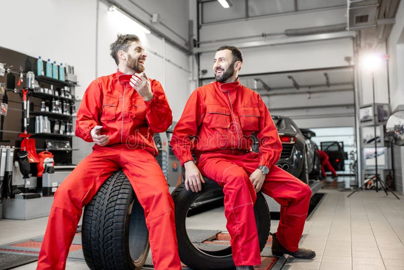 Car Service Workers during the Break at the Tire Mounting Service Stock ...
