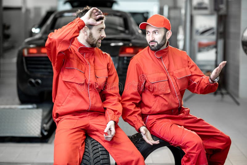 Car Service Workers during the Break at the Tire Mounting Service Stock ...
