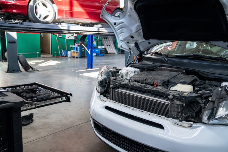 Car Service Workshop with Cars on a Column Lifts Editorial Photography ...