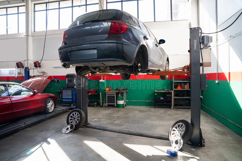 Car Service Workshop with Cars on a Column Lifts Editorial Stock Image - Image of interior ...
