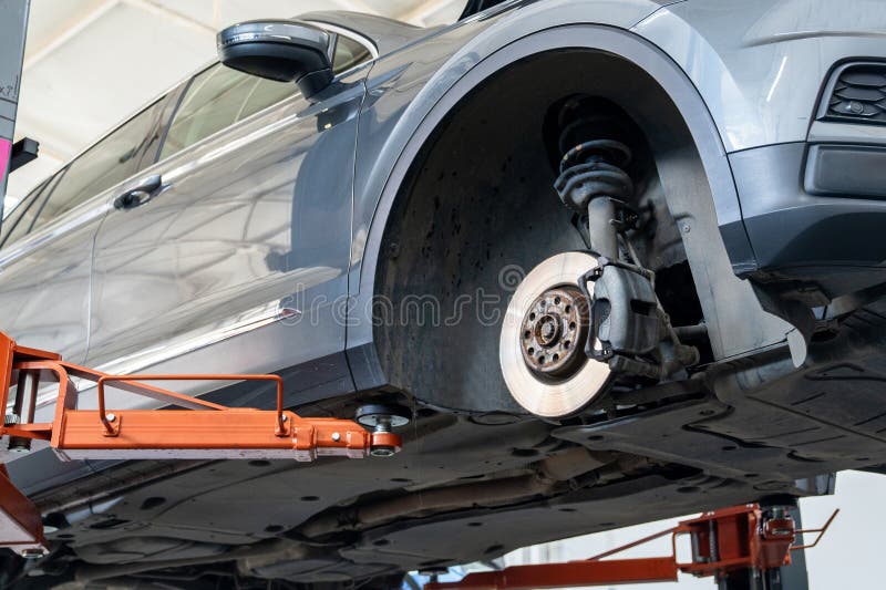 Car Service Workshop with Cars on a Column Lifts Stock Photo - Image of ...