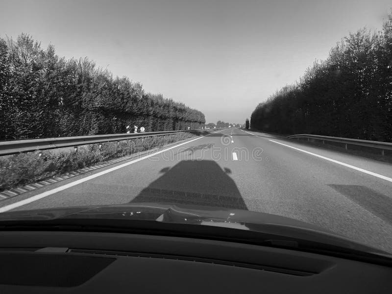 Car Shadow on German Autobahn Black and White Stock Photo - Image of ...