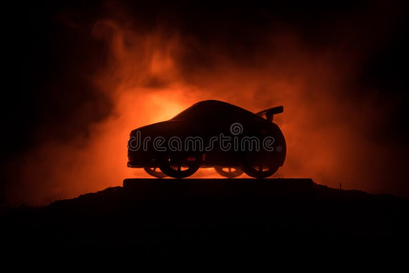 The Car in the Shadows with Glowing Lights in Low Light, or Silhouette ...