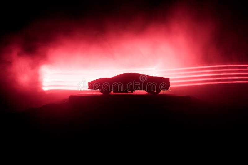 The Car In The Shadows With Glowing Lights In Low Light, Or Silhouette ...
