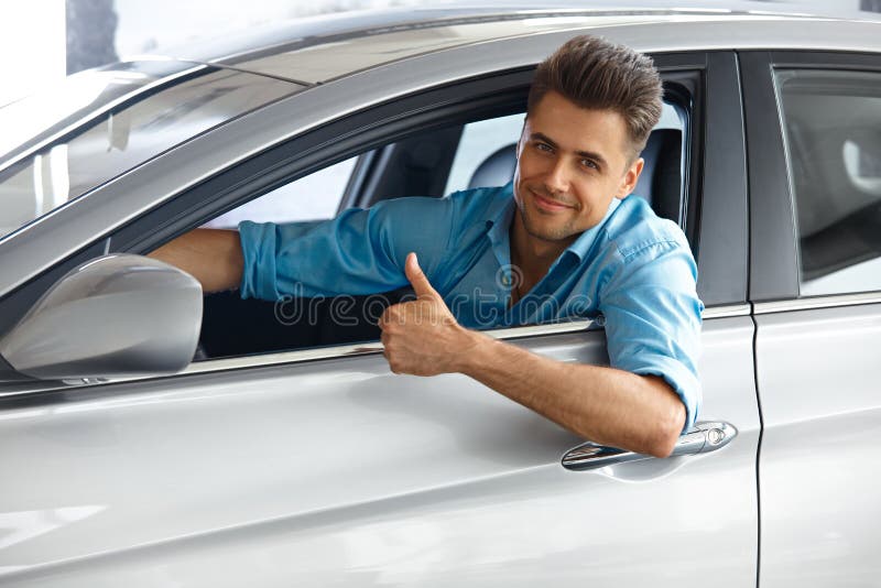 Car Showroom. Happy Customer Inside Car of His Dream. Stock Photo ...