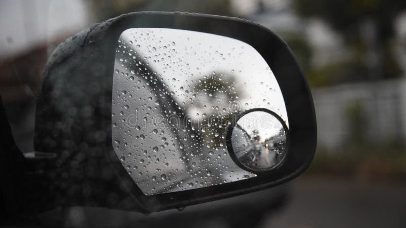 Car Side Mirror and Drivers Window with Drops of Rain Stock Footage ...