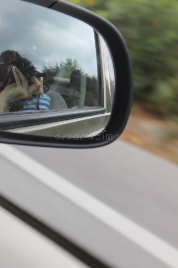 Car Side Mirror Reflection with Person Holding the Camera Stock Image ...