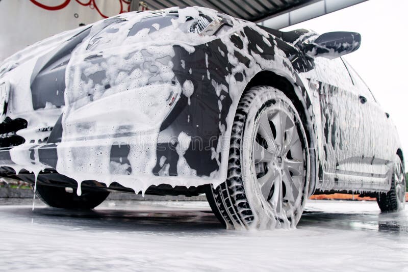 Car Side View in a Cleaning Agent at the Car Wash Stock Image - Image ...