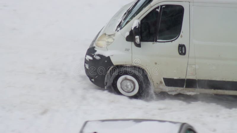 The Car Slips in the Snow Under Which There is Ice on the Road in ...