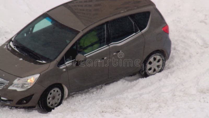 The Car Slips in the Snow Under Which There is Ice on the Road in ...