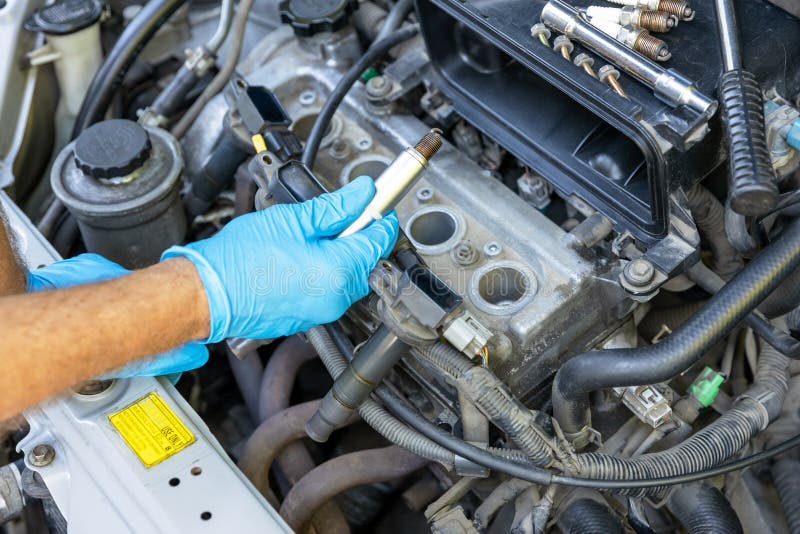 Car Spark Plug Replacement. Repairing of Vehicle. Stock Photo - Image ...