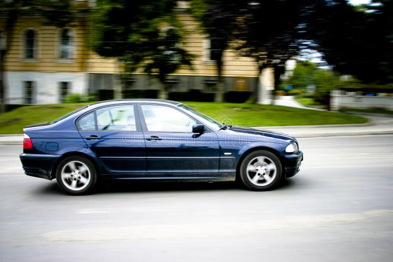 Car speeding down street stock image. Image of moving - 2822355