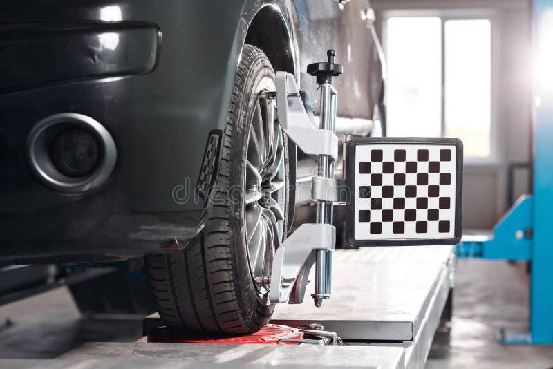 Car on Stand with Sensors Wheels for Alignment Camber Check in Workshop ...