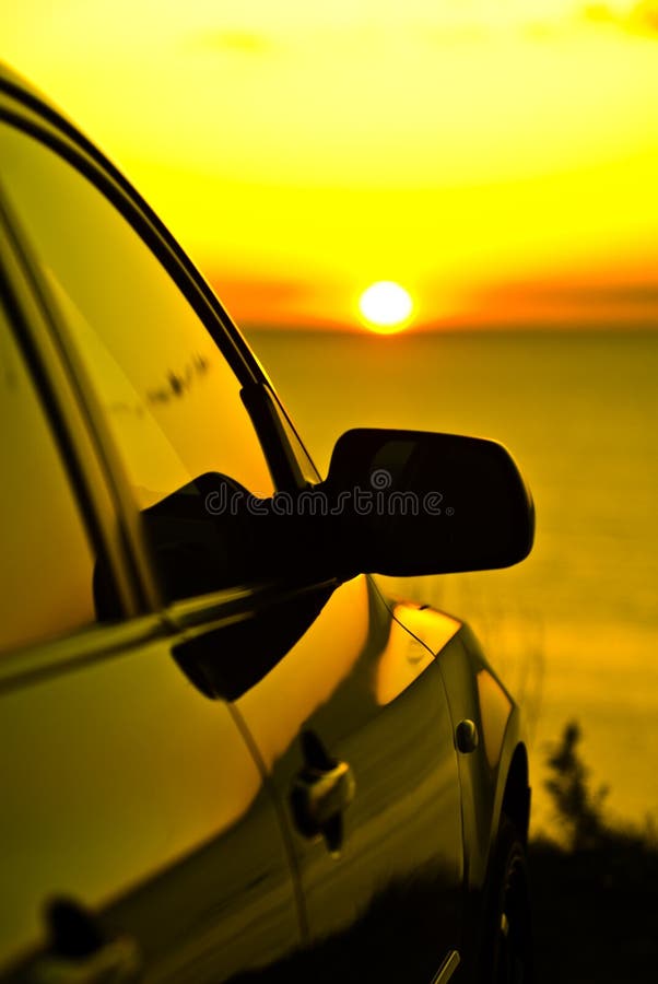 Car Parked at Sunset stock photo. Image of sedan, glow - 5192594