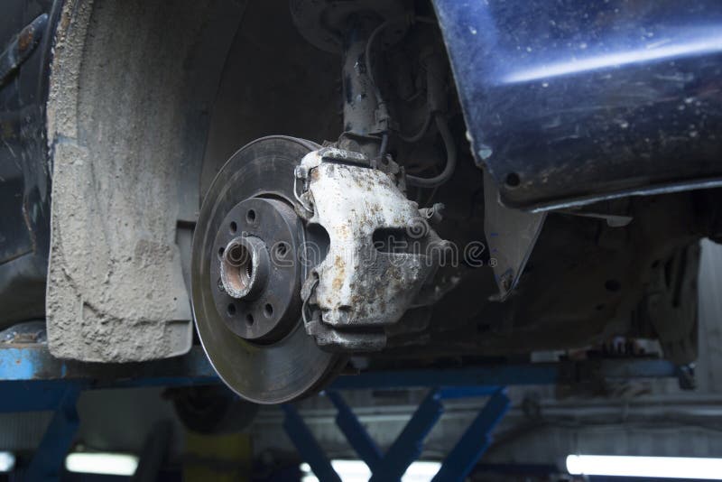 Car Suspension Repair. Replacement of Brake Discs and Pads Stock Image ...