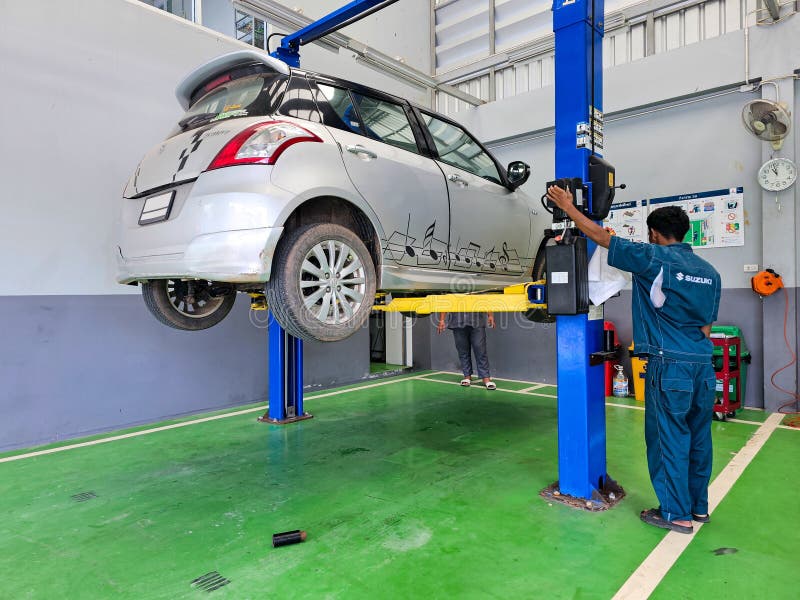 Car in Suzuki Service Center. the Car on the Lift Editorial Stock Image ...