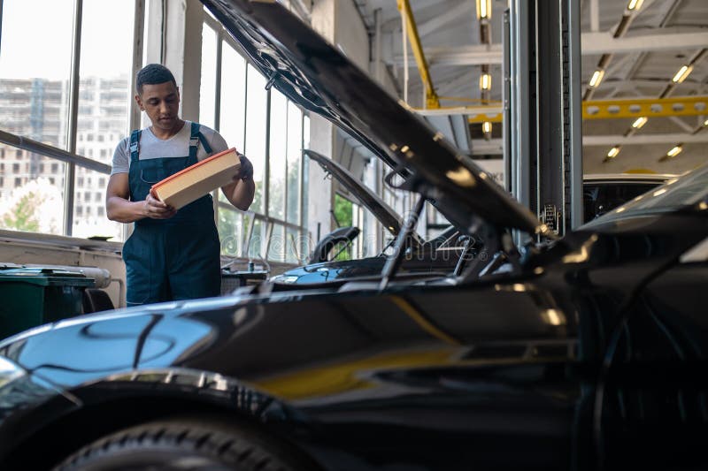 Auto Repair Worker Fixing the Client Car Stock Image - Image of ...