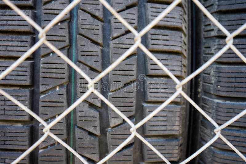 Car Tire Seen through Fence Stock Image - Image of road, closeup: 98240087