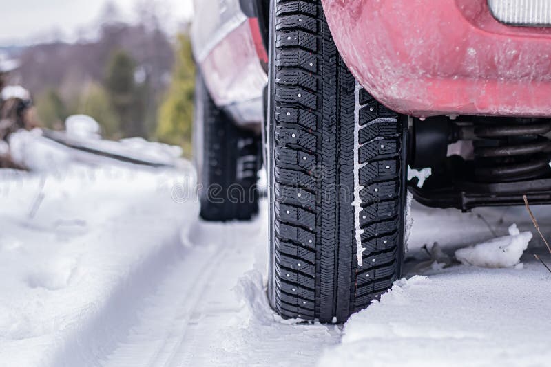 Car Tire in the Snow with a Tread Stock Photo - Image of drive ...