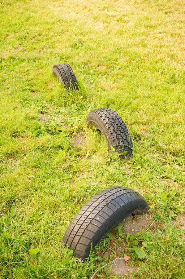 Tires on the Ground in the Forest. an Empty Obstacle Course in the ...