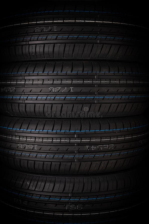 Car Tires Stacked in a Row. Concept of Tire Fitting. Stock Image ...