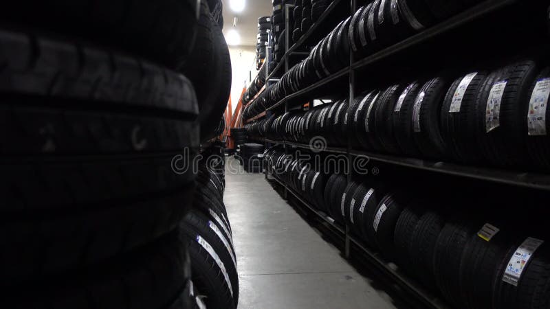 Car Tires at Warehouse in Tire Store. a Huge Warehouse of a Car Tires ...