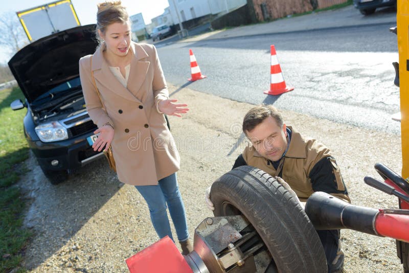 Car Tow Worker Fixing Car Problem on Road Stock Image - Image of polite ...