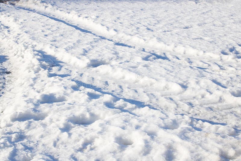 Car Tracks in the Snow in Sunlight Stock Image - Image of foot ...