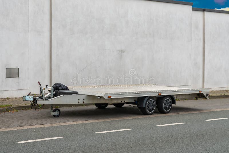 Car Trailer Platform Standing on the Side of the Road Along a Concrete ...