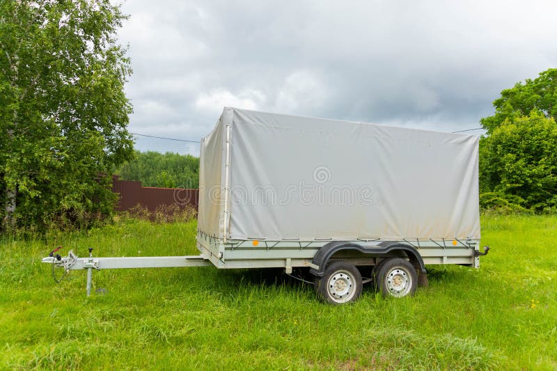 A Car Trailer with Two Axles is Parked Stock Image - Image of trailer ...
