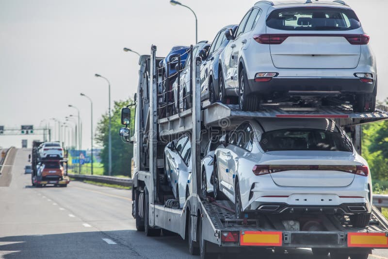 Car Transporter Trucks Move Along Highway Stock Image - Image of motion ...