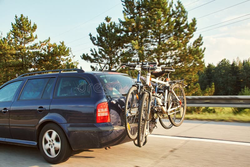 Car is Transporting Bicycles on Rack. Bikes on the Trunk. Stock Photo ...