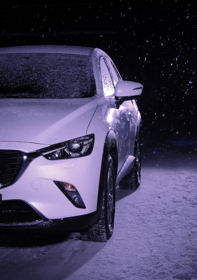 Car Turn Out Headlight in Front of Spotlight at Night Snowfall Stock ...