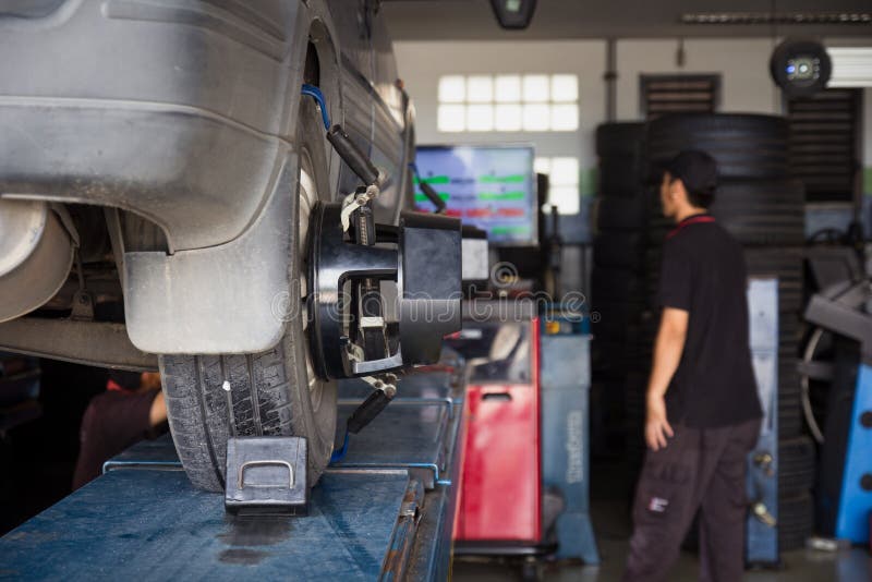 Car Tyre Alignment Wheel Balance at Garage Service Workshop. Stock ...