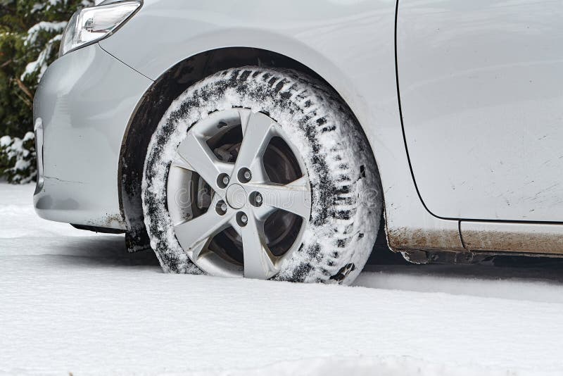 Car tyre in snow stock photo. Image of slippery, snowfall - 203639720