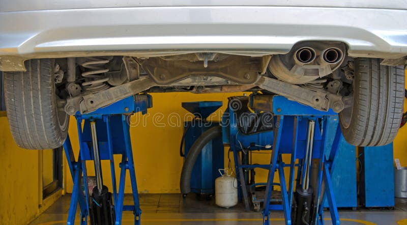 Car Under Repair on Hoist at Service Station Stock Photo - Image of ...