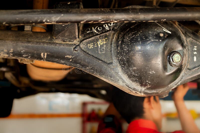Leveraged Car Undercarriage Inspection by Mechanic at a Garage Stock ...