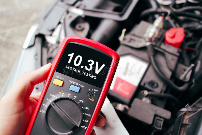 Digital Multimeter in the Hands of Mechanics for Measuring Car ...