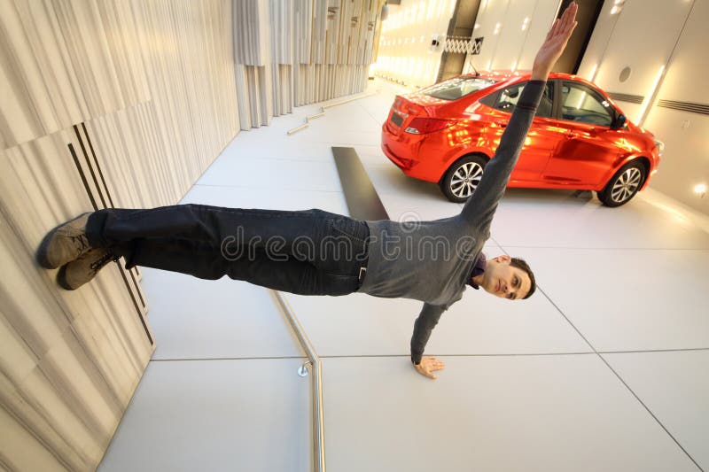 Car on Wall and Man Poses with Hands To Stock Photo - Image of house ...