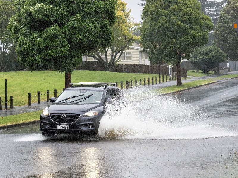 A Car is Splashing in a Puddle on the Street Editorial Photo - Image of ...