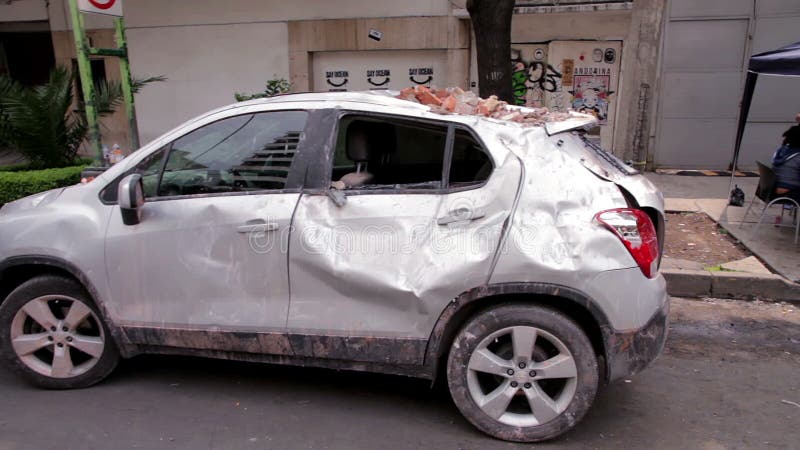 A Car Was Smashed by the Fall of Building Debris. Stock Footage - Video ...