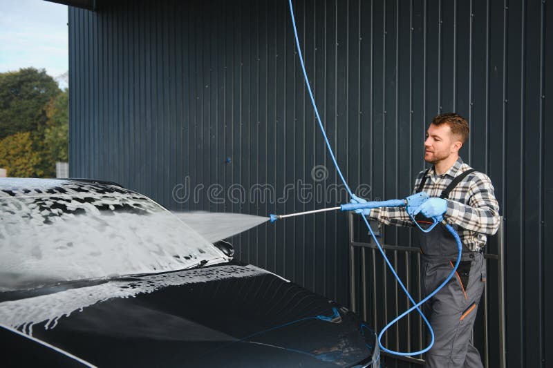 Car Wash Specialist Using Pressure Washer To Rinse a Car Stock Image ...