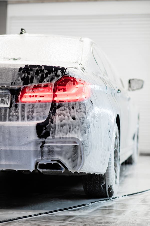 Car Washing Process. Foaming Detergent Covers Side of the Car, Clean it ...