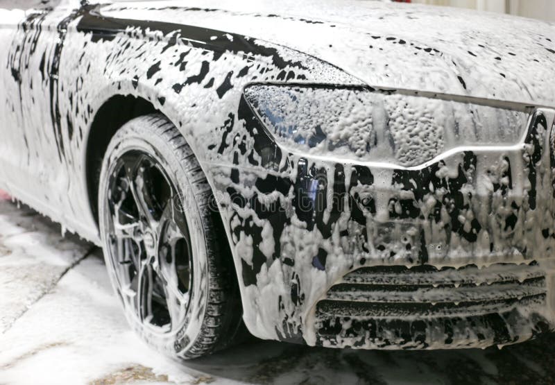 Car Washing Process. Foaming Detergent Covers Side of the Car, Clean it ...