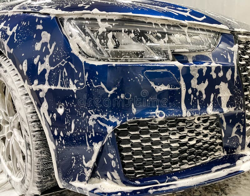 Car Washing Process. Foaming Detergent Covers Side of the Car, Clean it ...