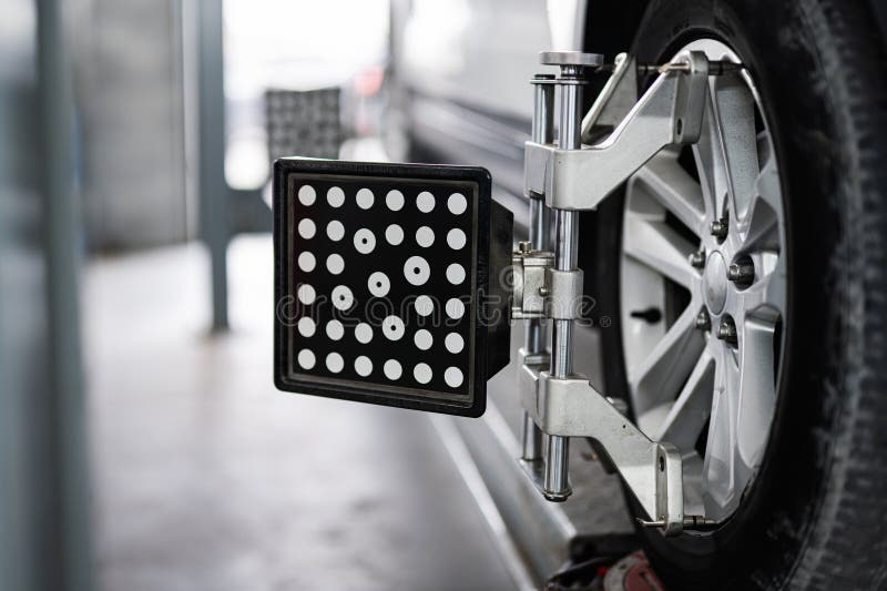 Car Wheel Alignment with Specialized Equipment in Auto Repair Shop ...