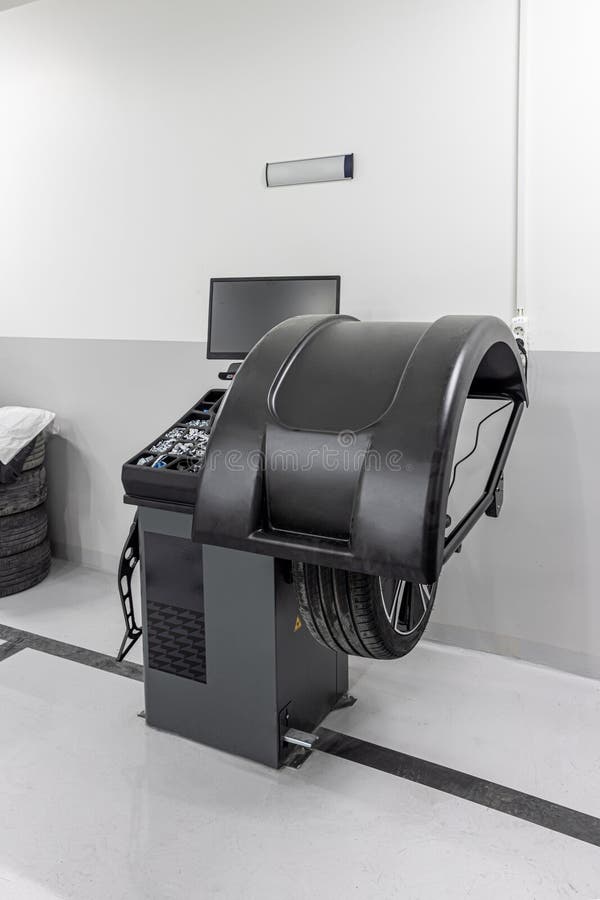 Car Wheel Balancing Service. Car Wheel Balancing in Tire Service Stock ...