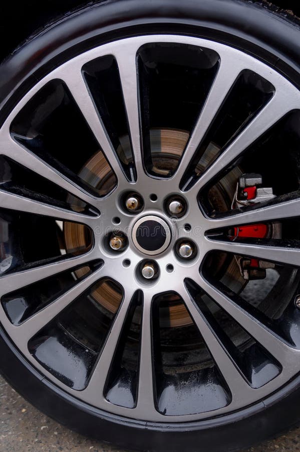 Car Wheel with Brake Calipers and Stylish Design. Stock Photo - Image ...