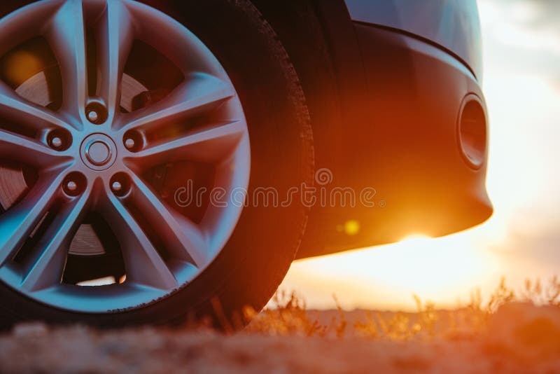 Car Wheel Close-up View in Desert Area at Sunset Stock Photo - Image of ...