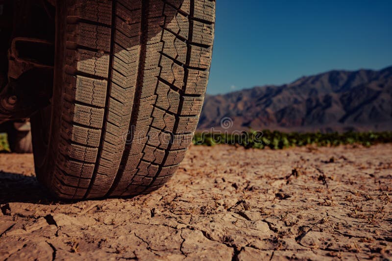 Car Wheel on Cracked Ground in Desert Stock Photo - Image of rubber ...